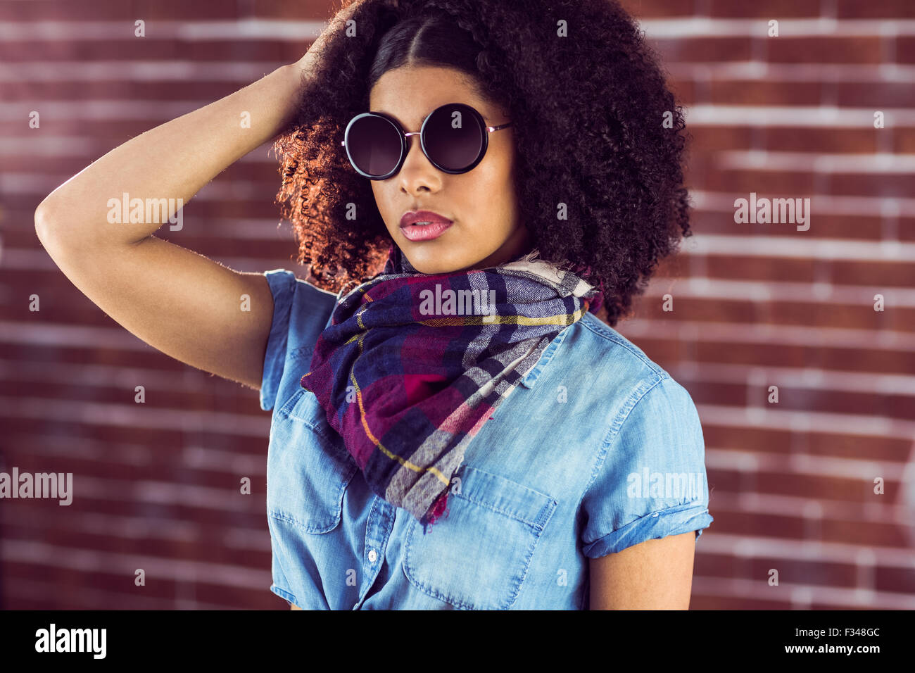 Attractive young woman wearing sunglasses Stock Photo - Alamy Attractive young woman wearing sunglasses Stock Photo - Alamy