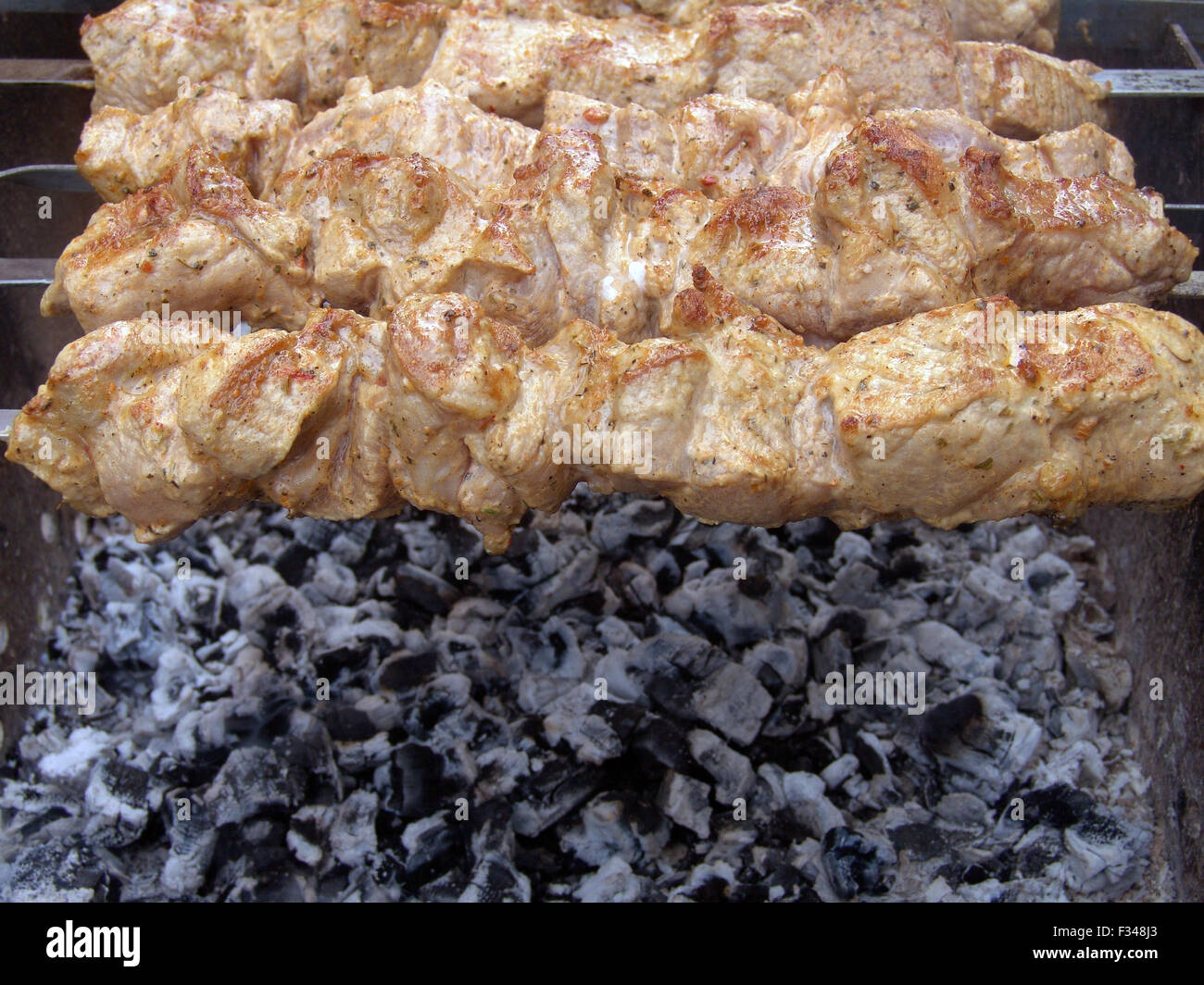 Process of preparation of a shish kebab, from uncooked to the cooked ...