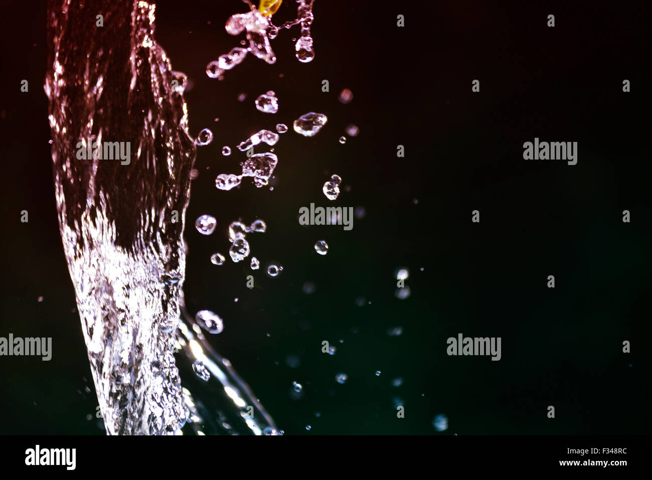 Summer water splash and drops on black background Stock Photo - Alamy
