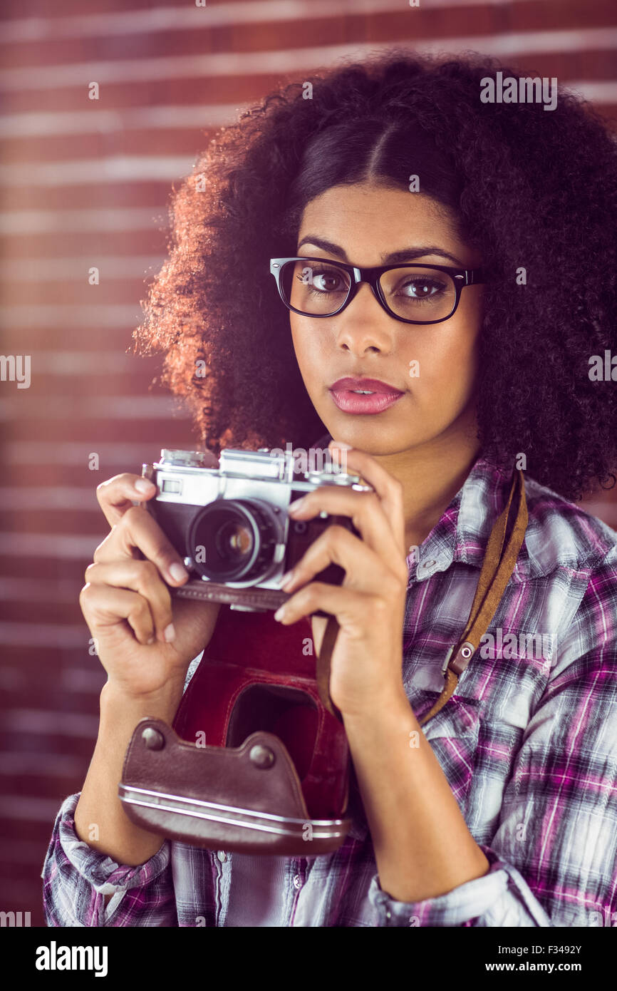 Attractive hipster photographing with camera Stock Photo - Alamy
