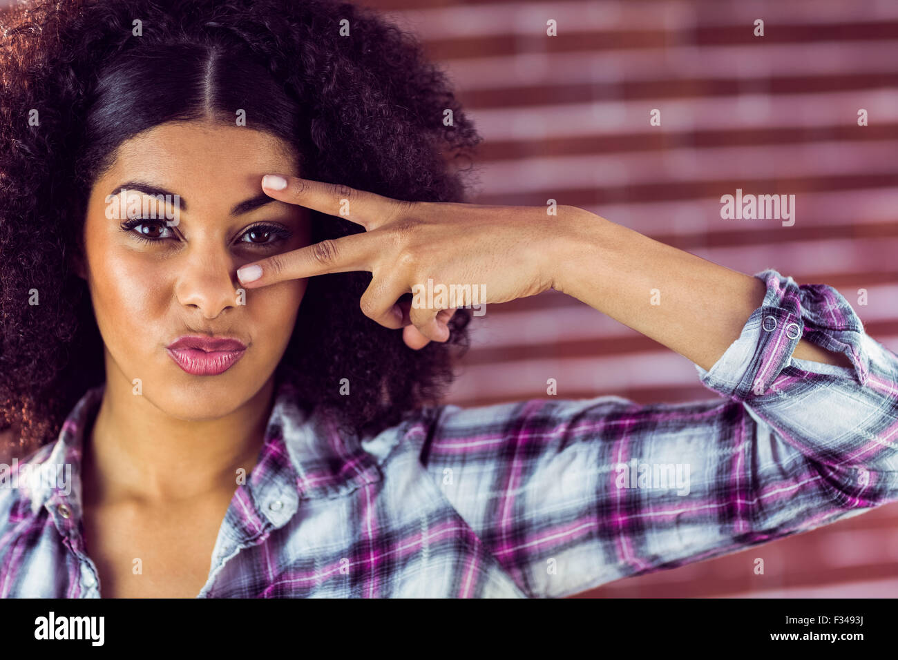 Woman showing peace hi-res stock photography and images - Alamy