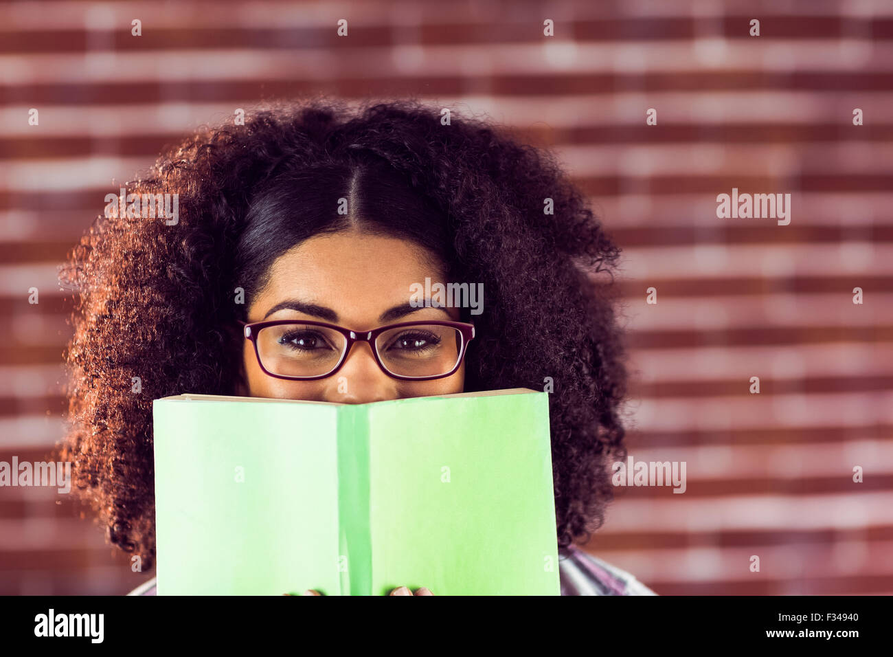 Hiding behind notebook hi-res stock photography and images - Alamy
