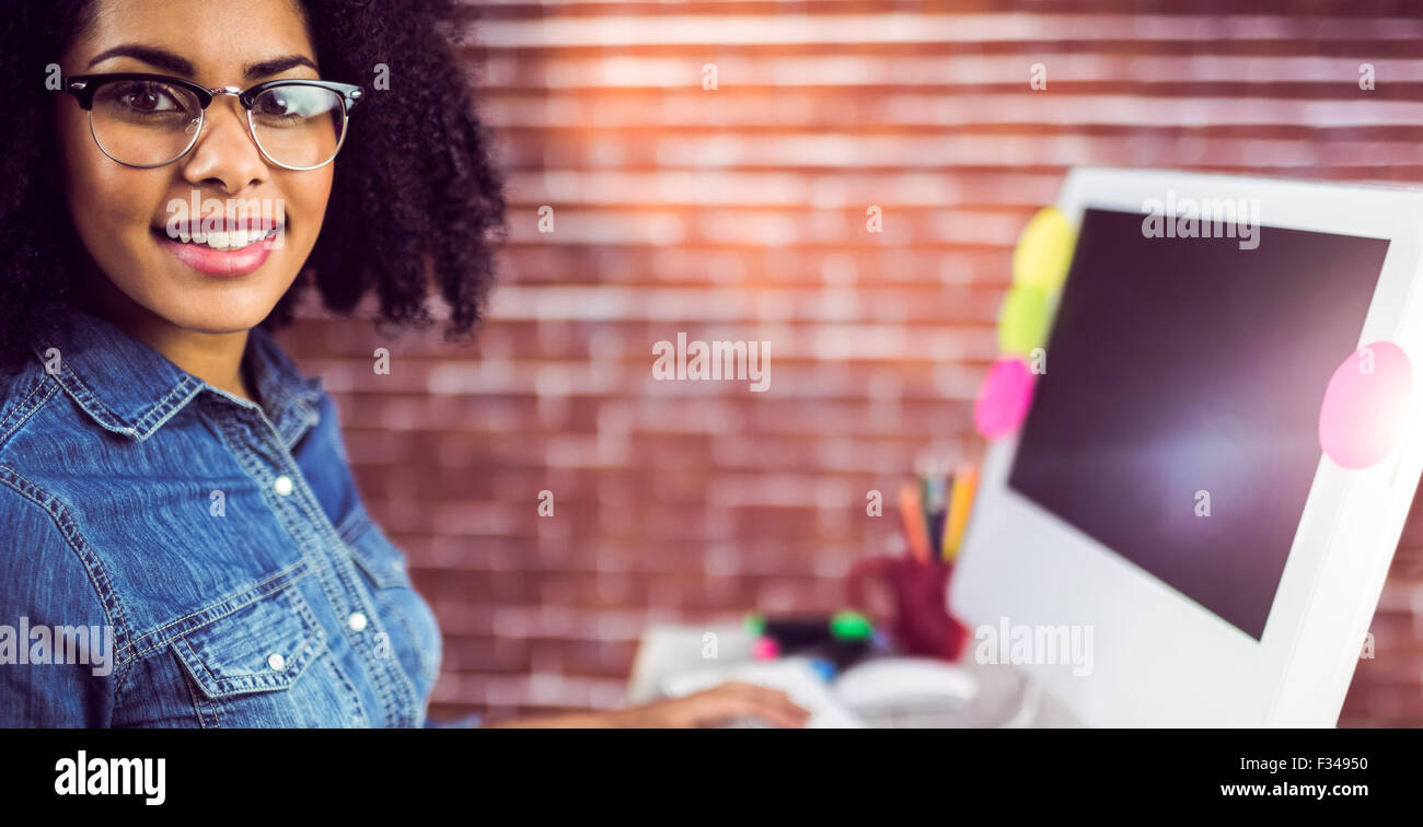Casual female designer smiling Stock Photo - Alamy