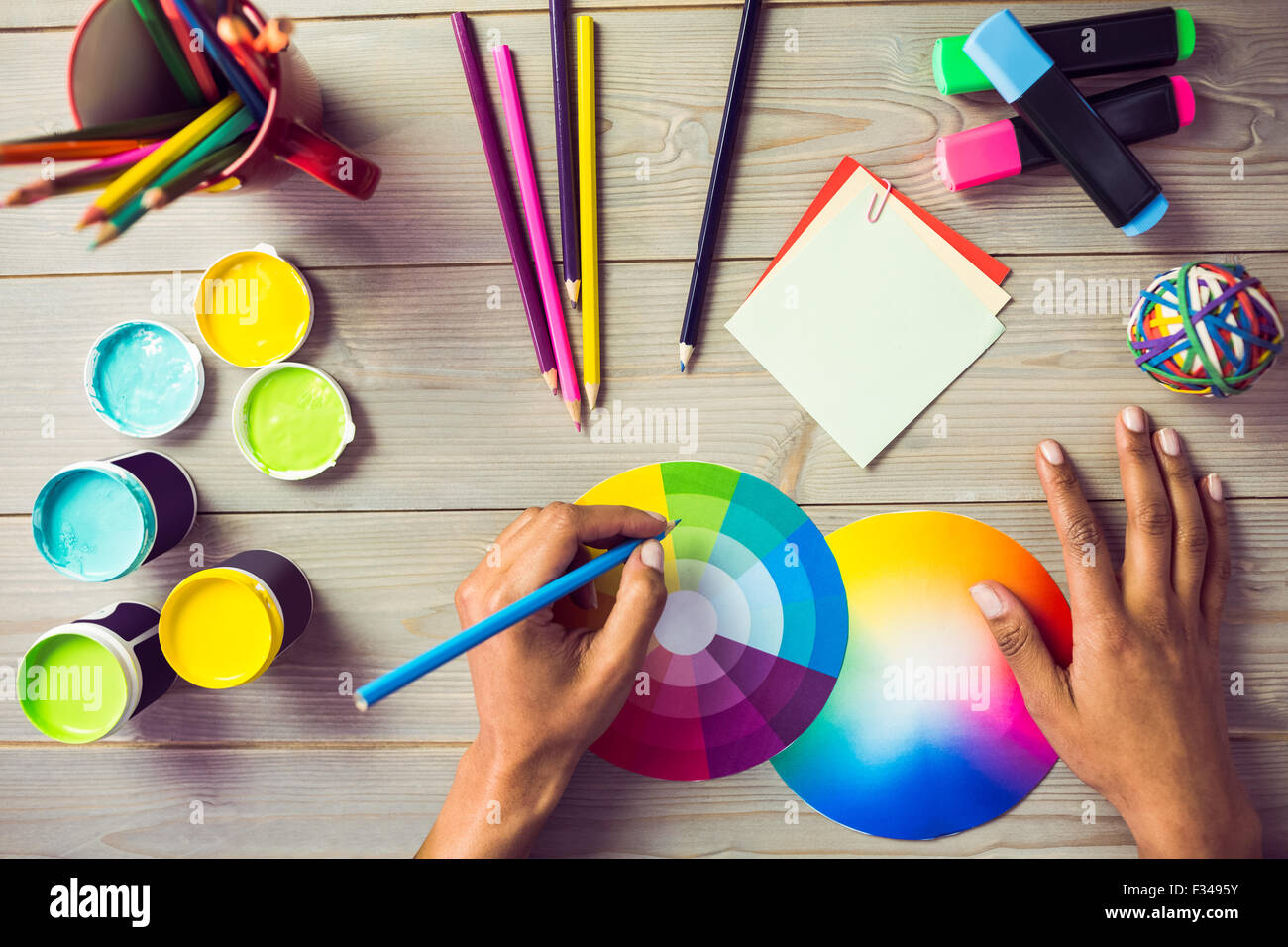 Graphic designer drawing on colour chart Stock Photo - Alamy