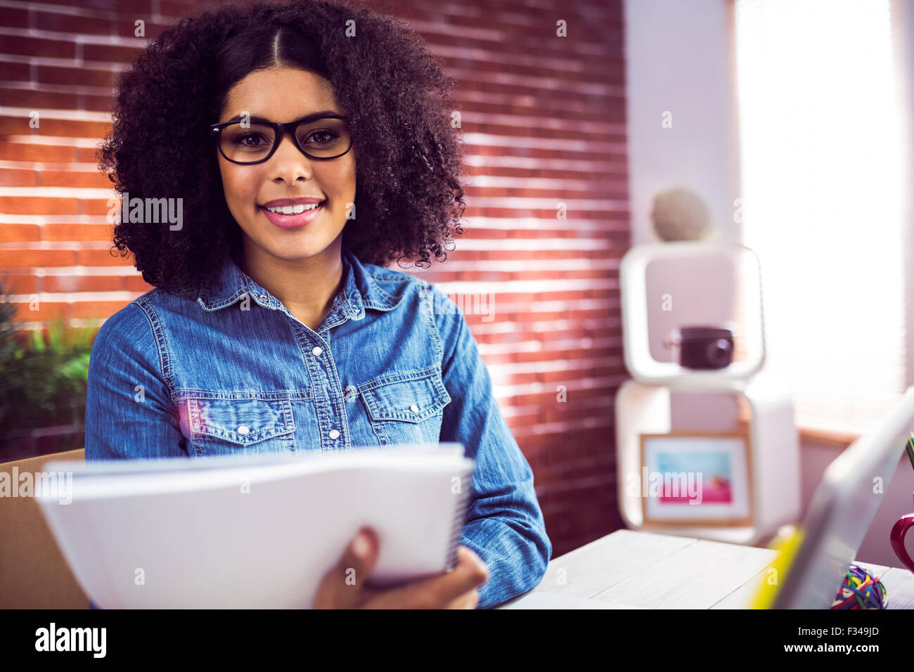 Young businesswoman holding reports hi-res stock photography and images ...