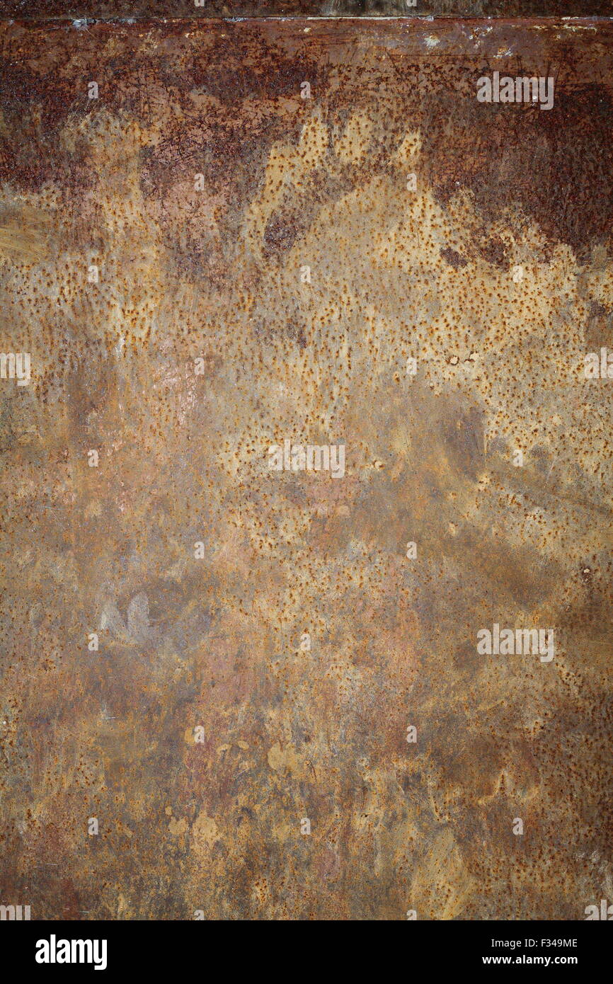 Rusty metal texture . This is a close up of a door where there is corn ...