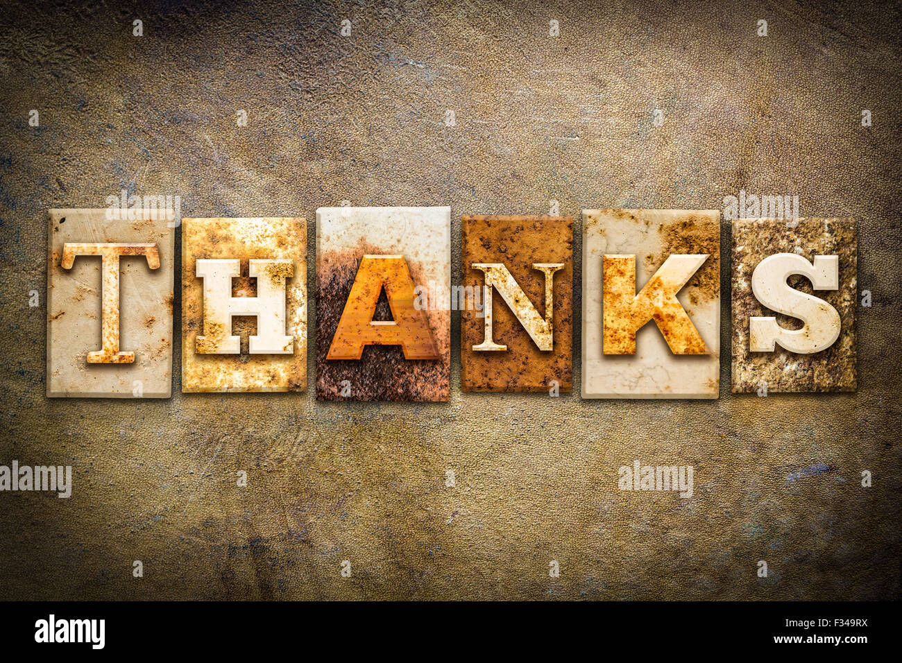 The word "THANKS" written in rusty metal letterpress type on an old ...