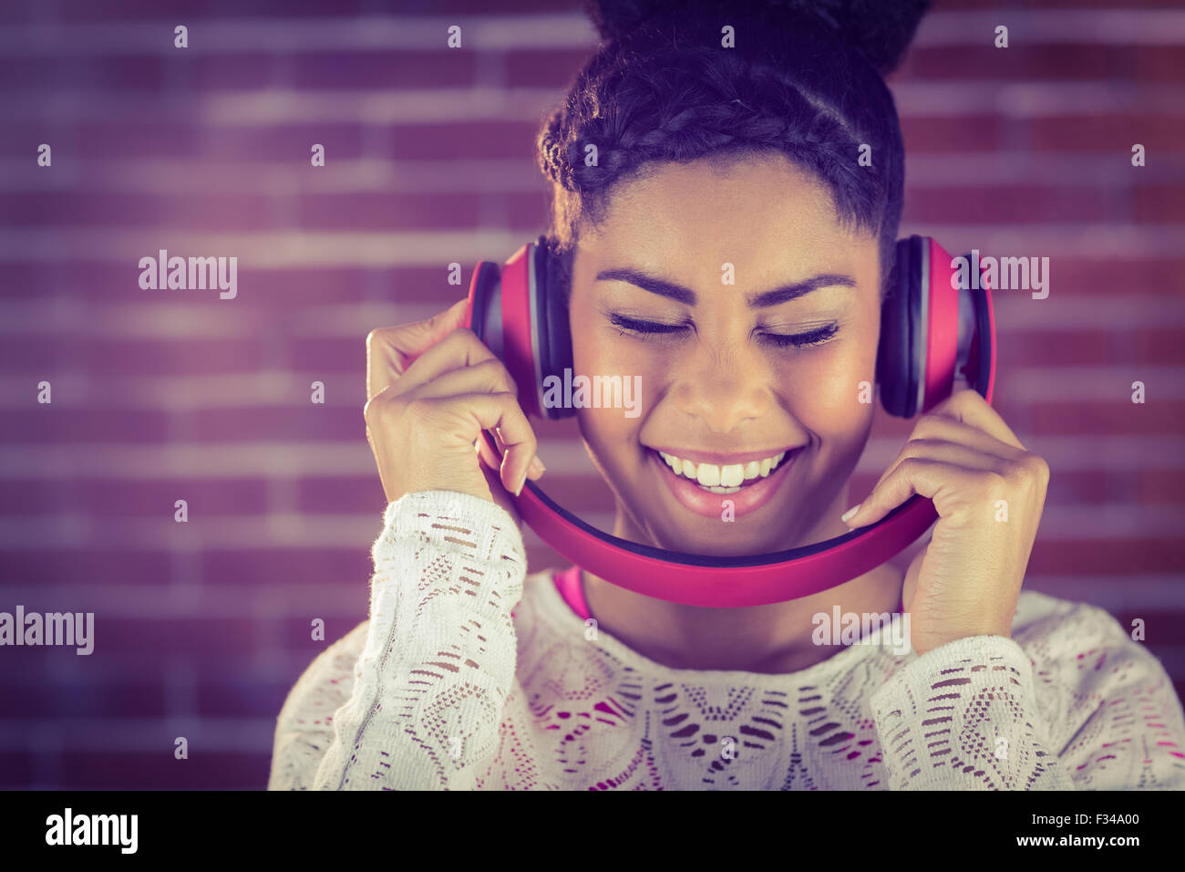 A smiling woman dancing with headphones Stock Photo - Alamy