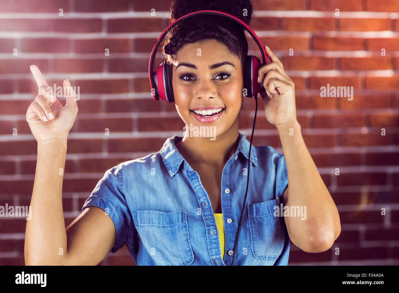 Portrait of young woman smiling at her song Stock Photo - Alamy