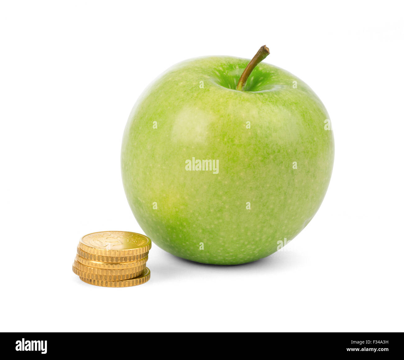 Fresh apple with coins Stock Photo - Alamy