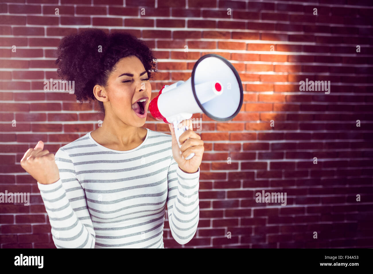 Black woman yelling megaphone hi-res stock photography and images - Alamy
