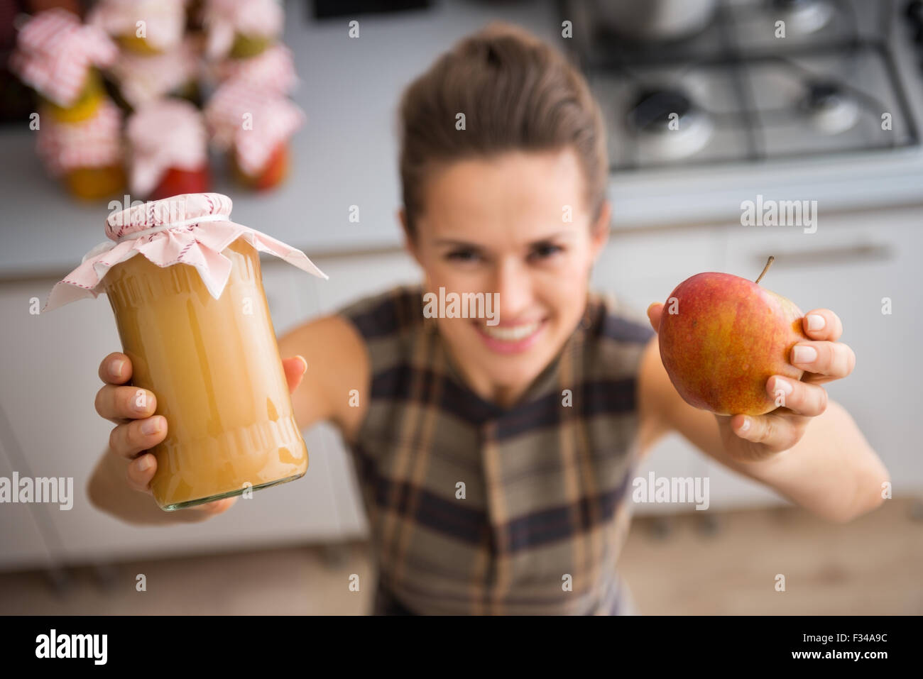 Oh, the sweet taste of home-made apple sauce... A happy woman is ...