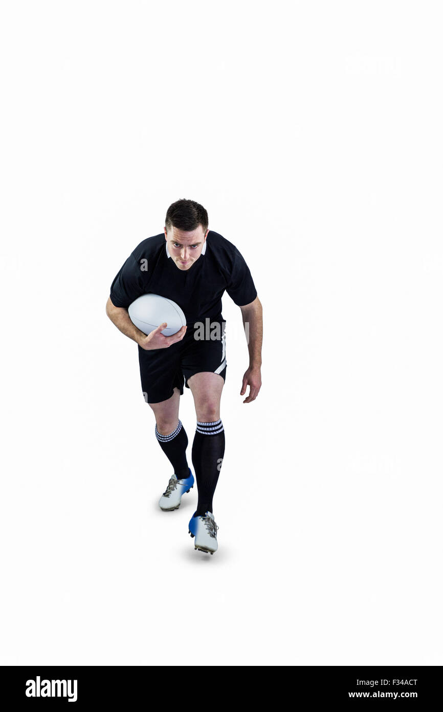 Rugby player running with the rugby ball Stock Photo - Alamy