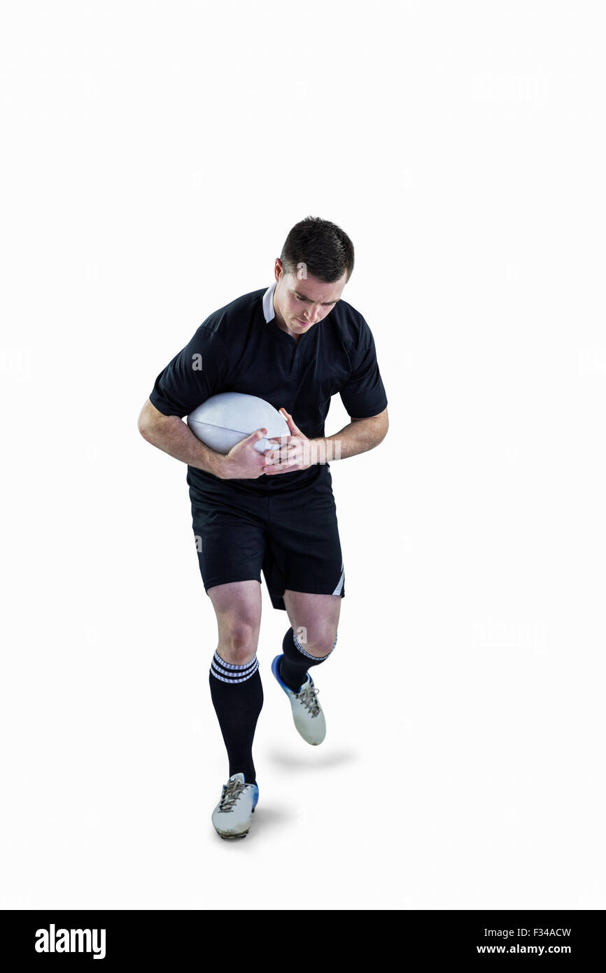 Rugby player running with the rugby ball Stock Photo - Alamy