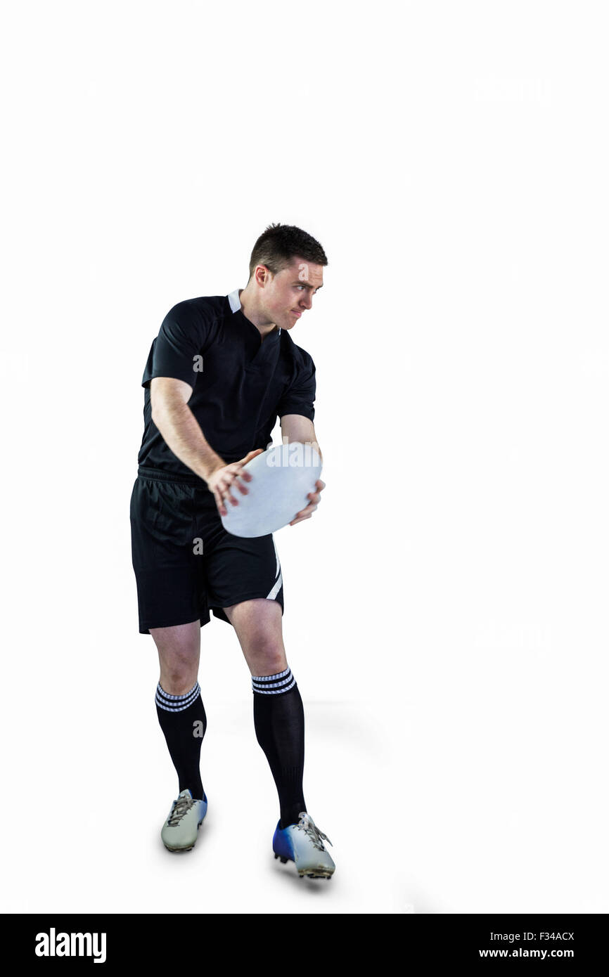 Rugby player doing a side pass Stock Photo - Alamy