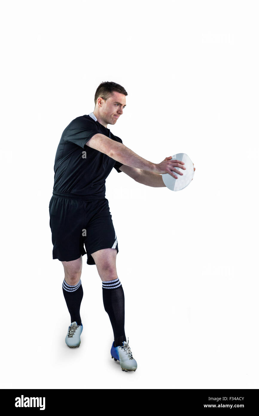 Rugby player doing a side pass Stock Photo - Alamy