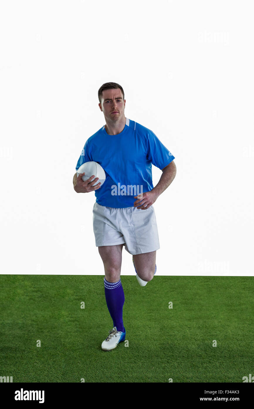 Rugby player running with the rugby ball Stock Photo - Alamy