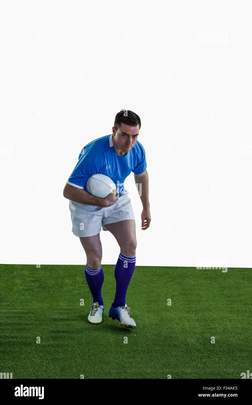 Rugby player running with the rugby ball Stock Photo - Alamy