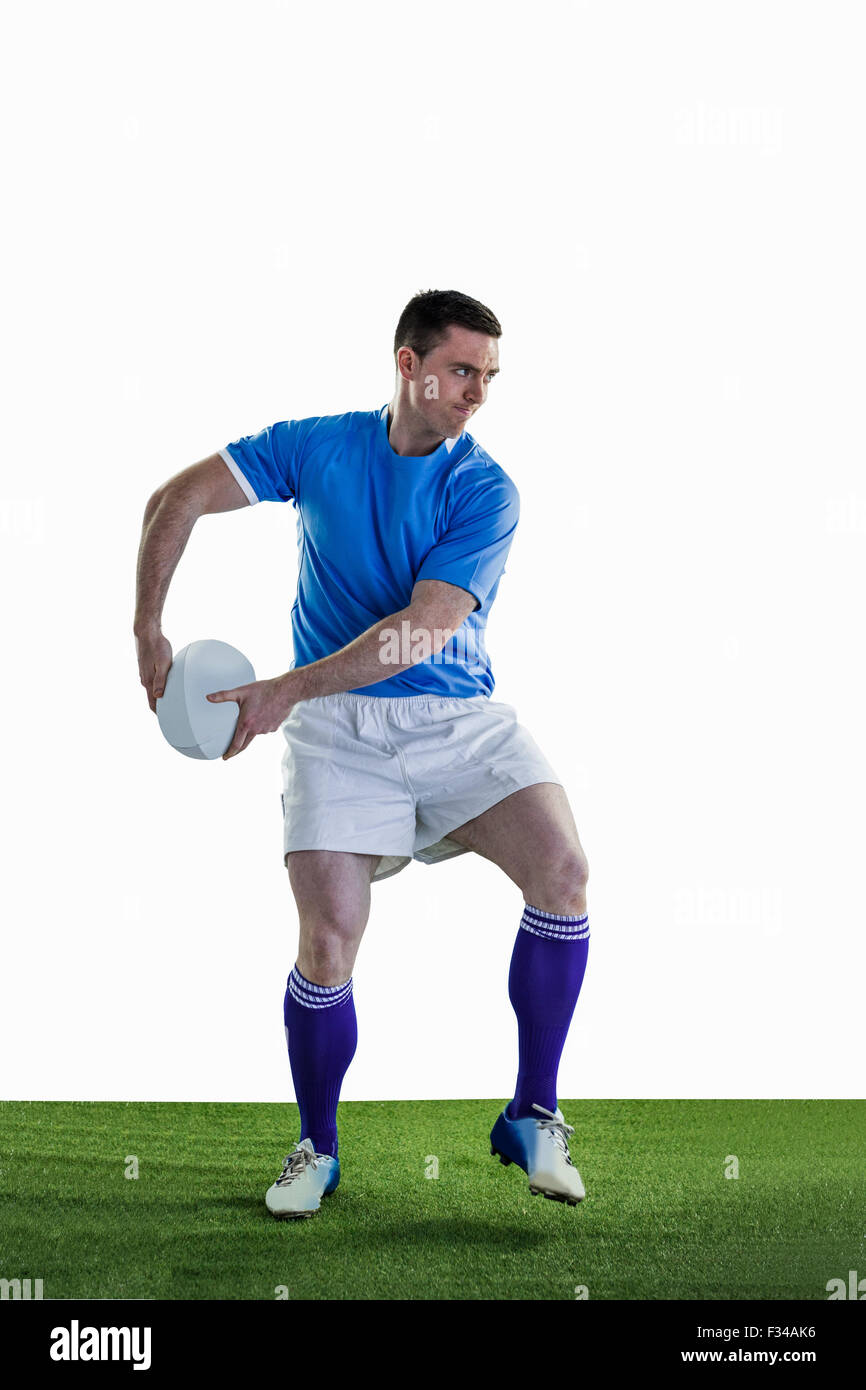 Rugby player doing a side pass Stock Photo - Alamy