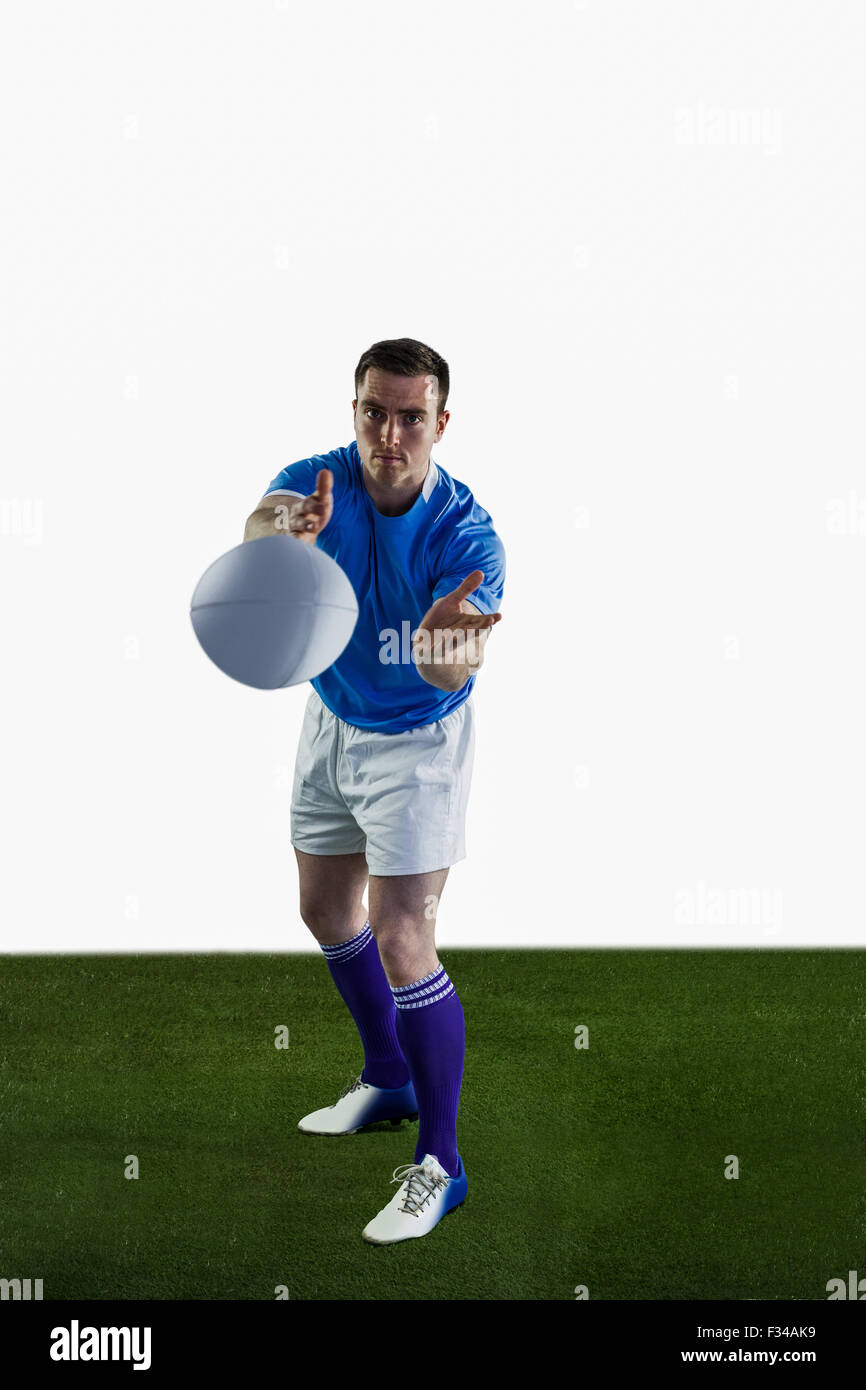 Rugby player throwing a rugby ball Stock Photo - Alamy