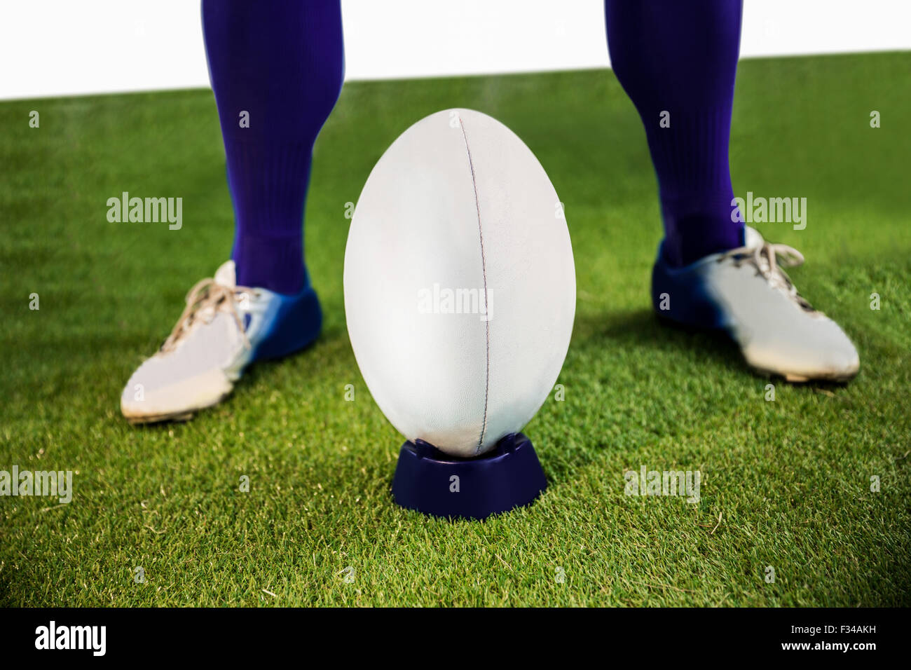 Rugby player ready to make a drop kick Stock Photo - Alamy