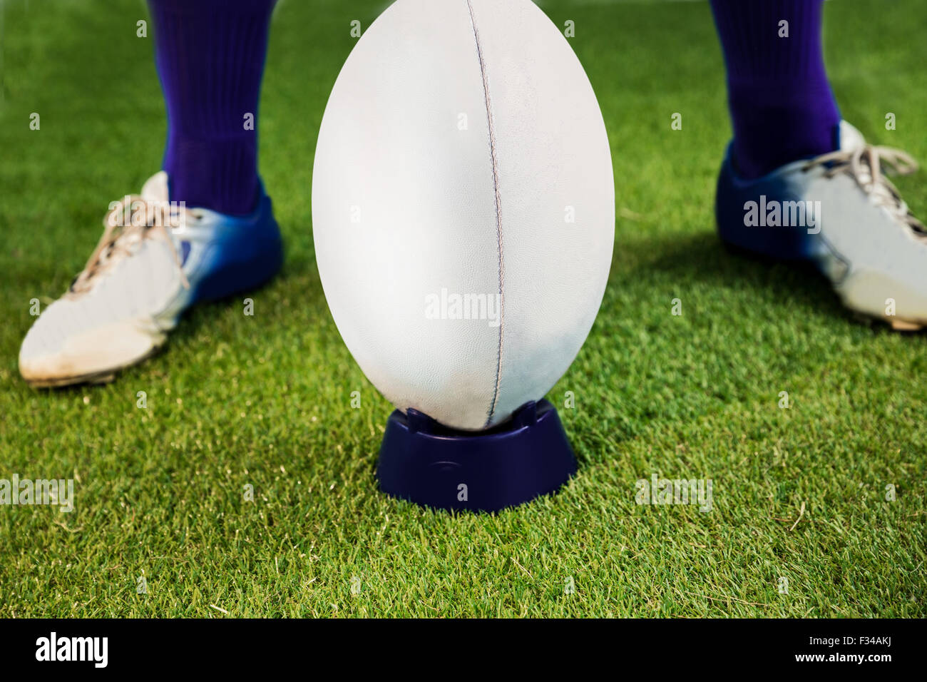 Rugby player ready to make a drop kick Stock Photo - Alamy