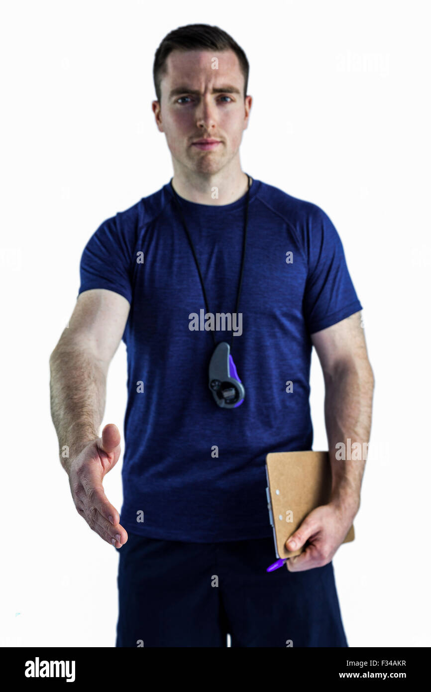 Smiling trainer holding a clipboard Stock Photo - Alamy