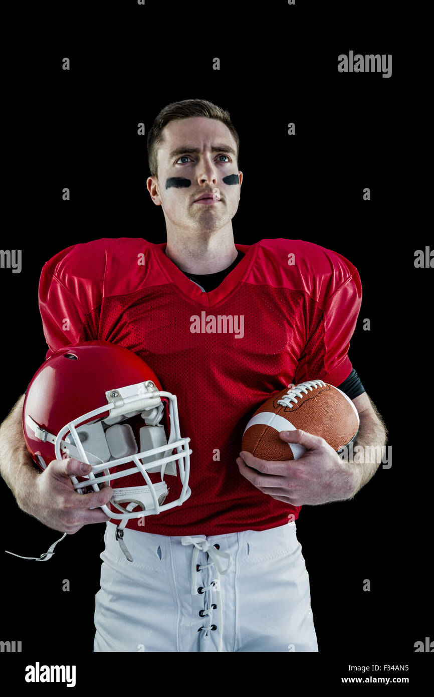 American football player holding helmet Stock Photo - Alamy