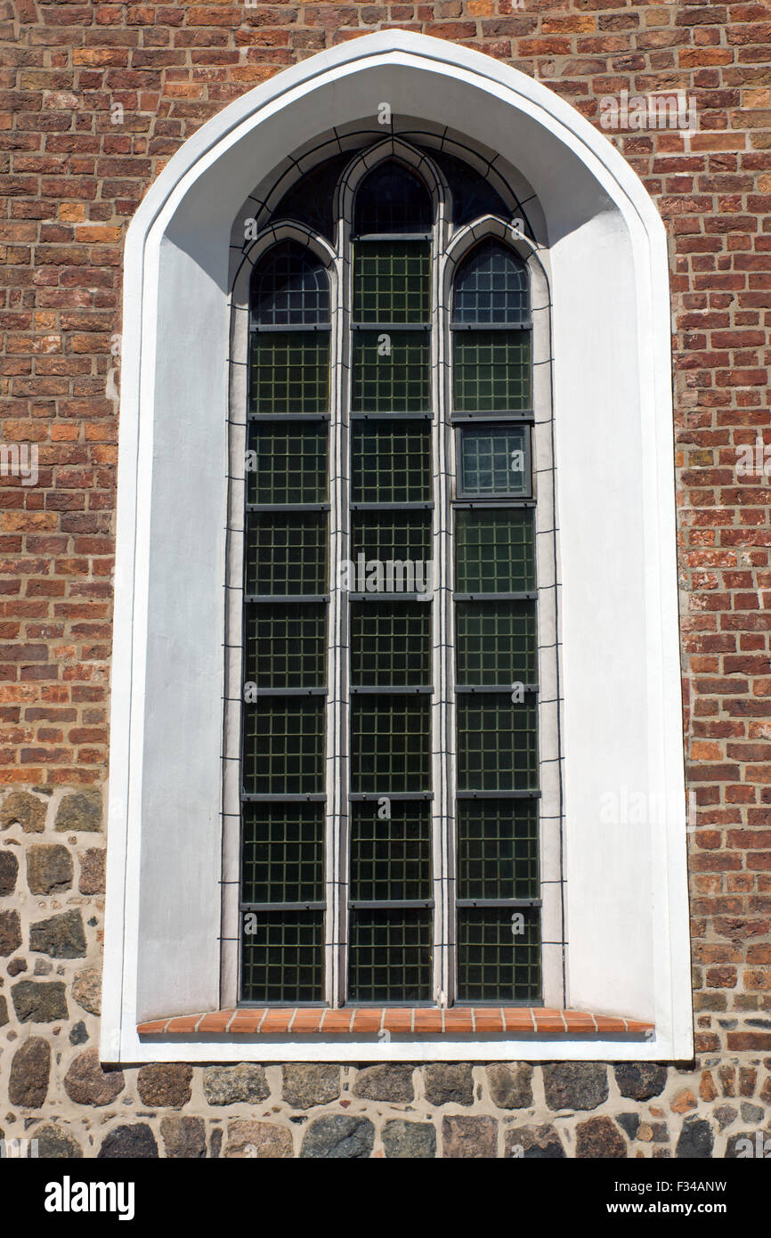 Old historic window of a church with a red brick wall Stock Photo - Alamy