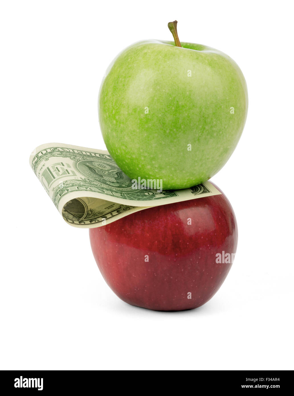 Two fresh apples with money Stock Photo - Alamy