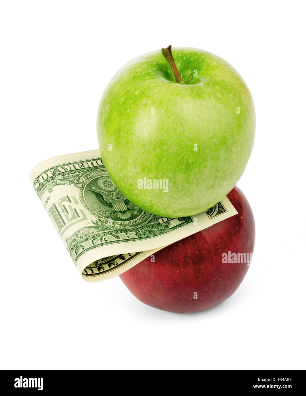 Two fresh apples with dollars Stock Photo - Alamy
