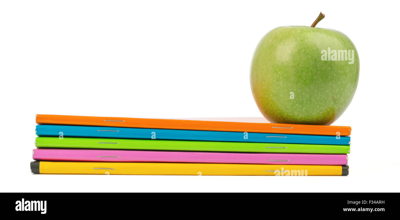 Fresh green apple with notebooks Stock Photo - Alamy