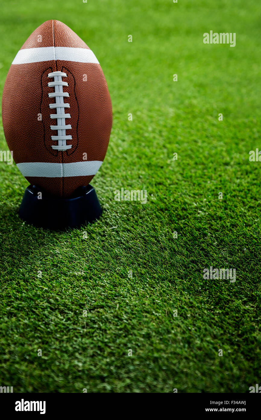 American football standing on holder Stock Photo - Alamy