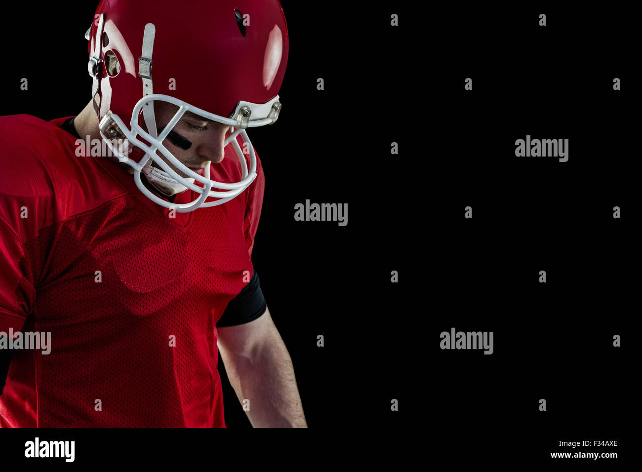 Close up view of american football player focusing Stock Photo - Alamy