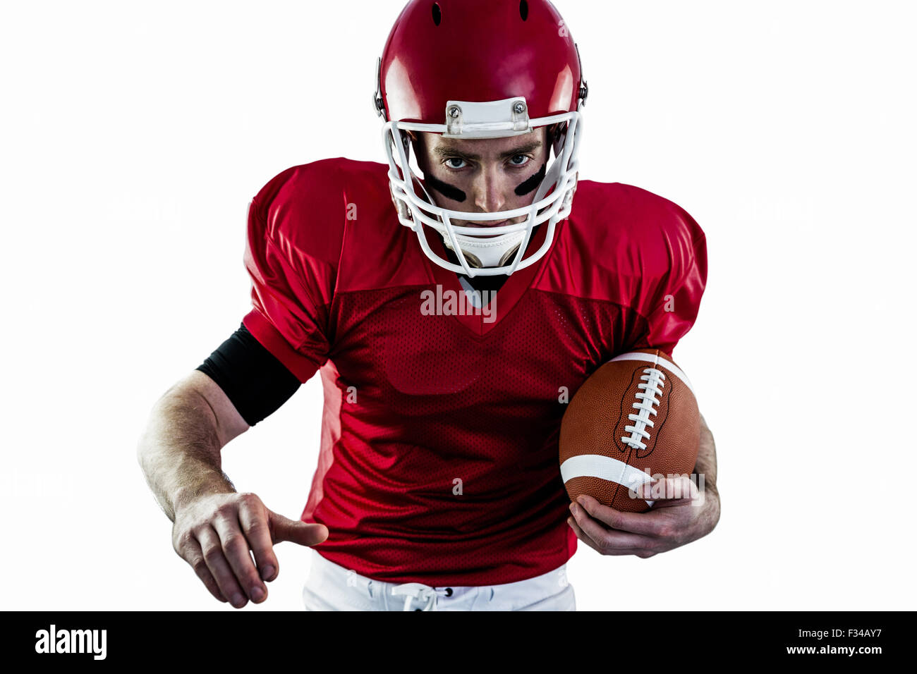 Portrait of focused american football player being ready to attack ...