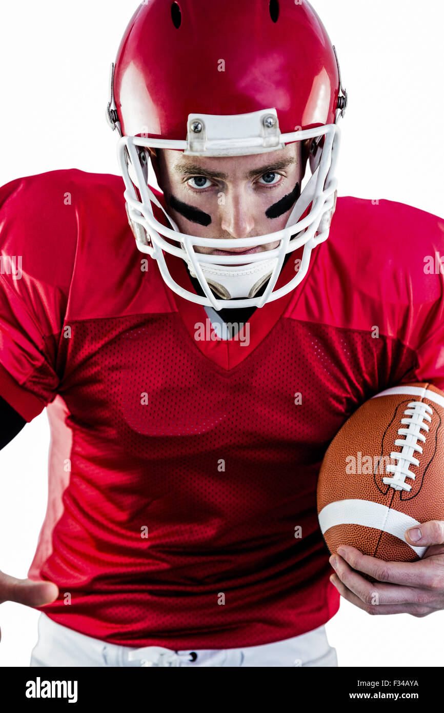 Portrait of focused american football player being ready to attack ...