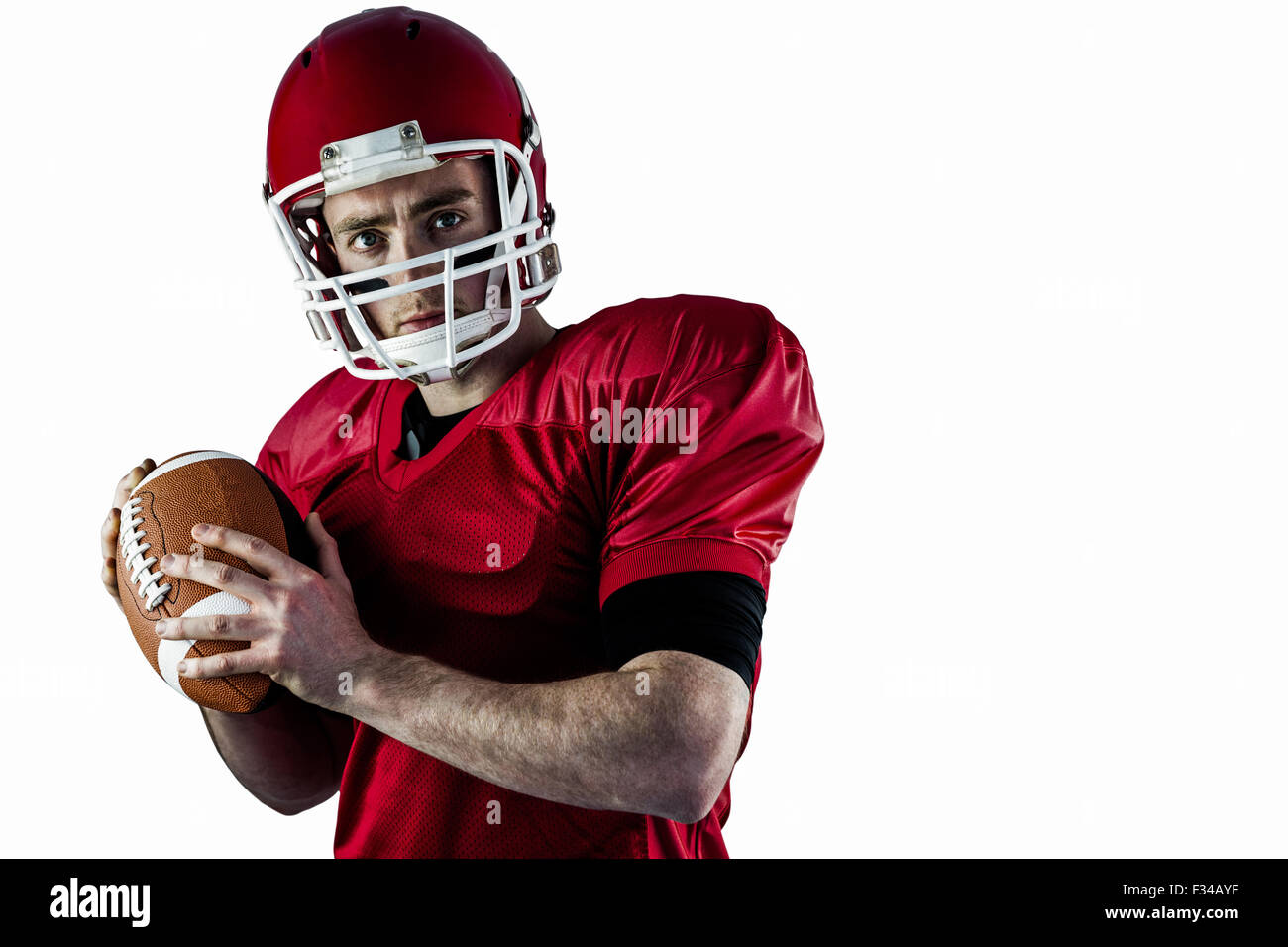 Portrait of american football player being about to throw football ...