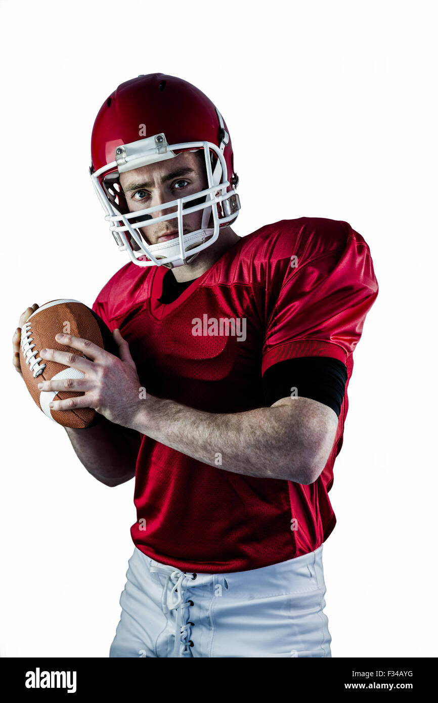 Portrait of american football player being about to throw football ...