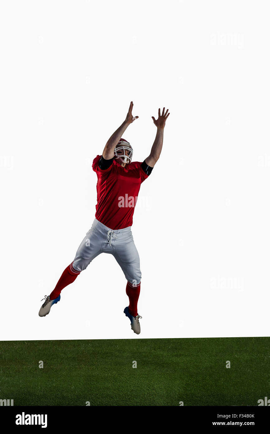 American football player trying to catch football Stock Photo - Alamy