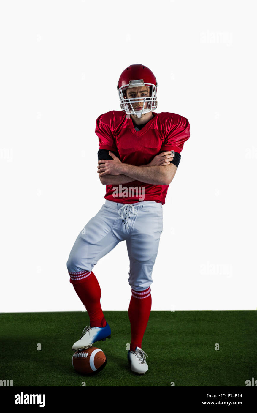 Portrait of american football player with arms crossed Stock Photo - Alamy