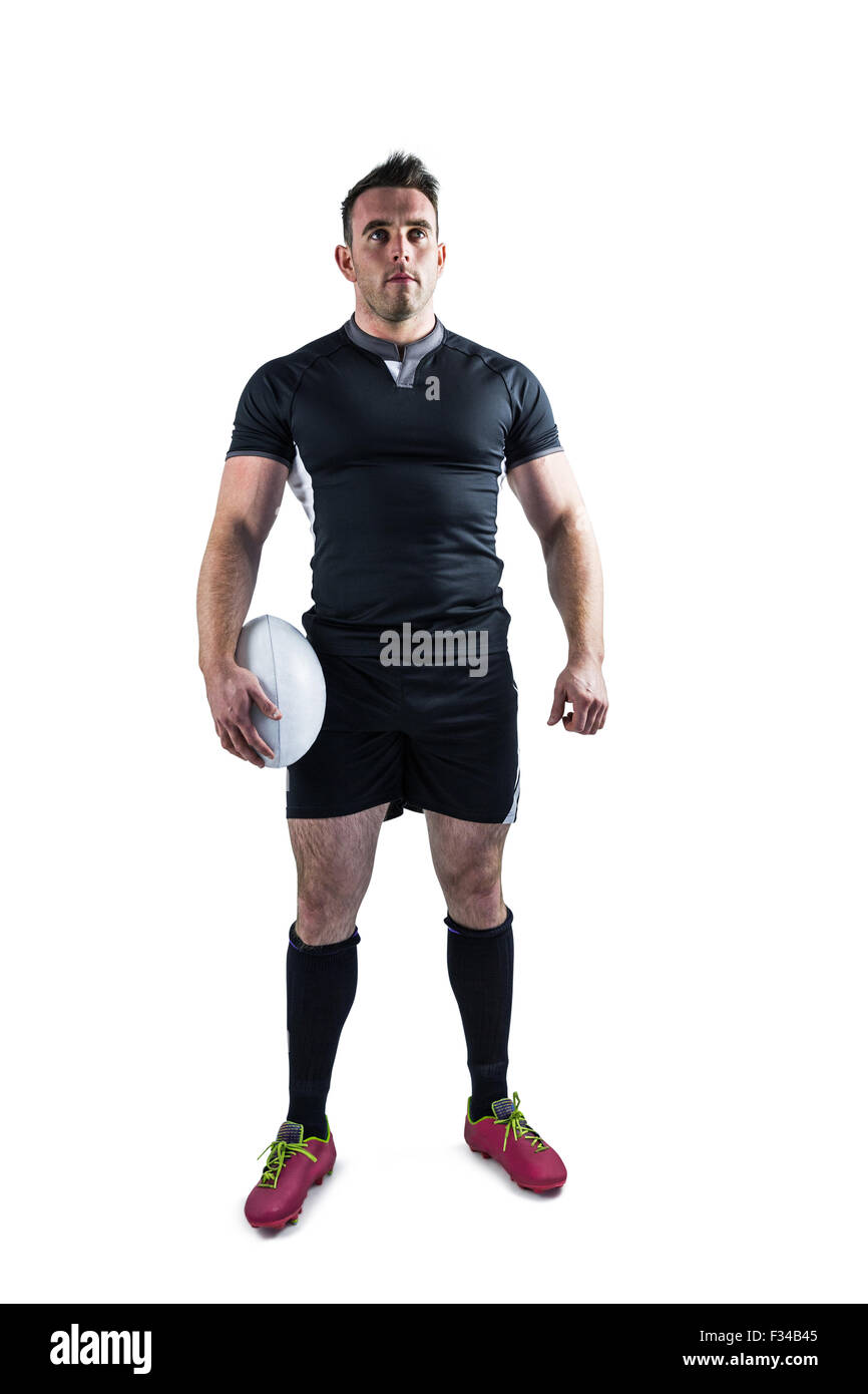 Tough rugby player holding ball Stock Photo - Alamy