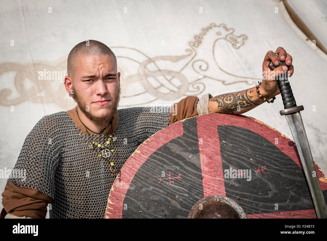 A close-up of a man dressed as a Viking with shield and sword, Ishøj ...