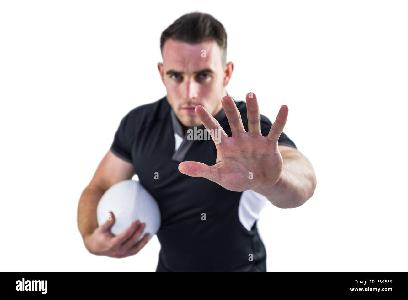 Tough rugby player looking at camera Stock Photo - Alamy