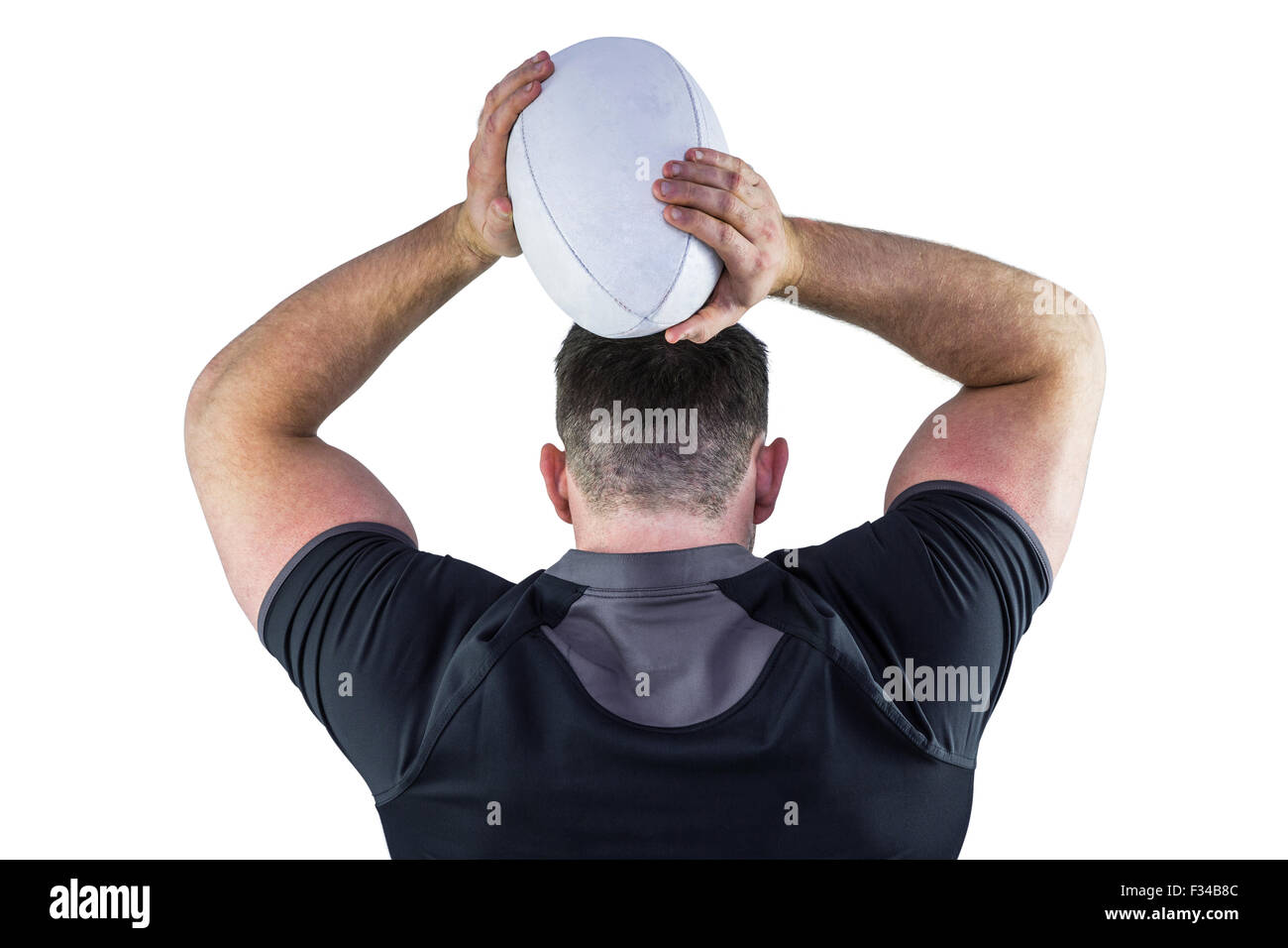 Tough rugby player throwing ball Stock Photo - Alamy