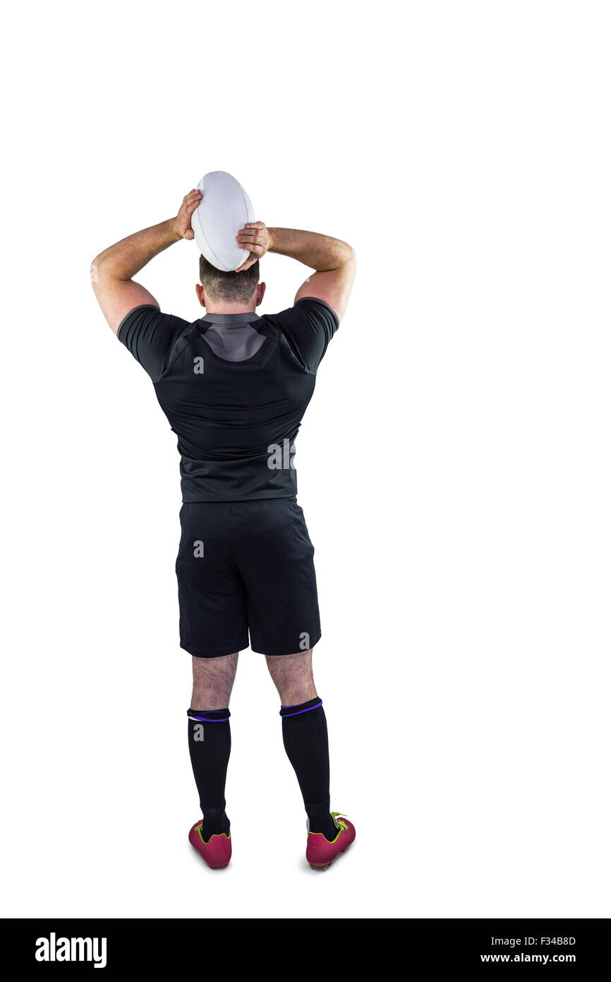 Tough rugby player throwing ball Stock Photo - Alamy