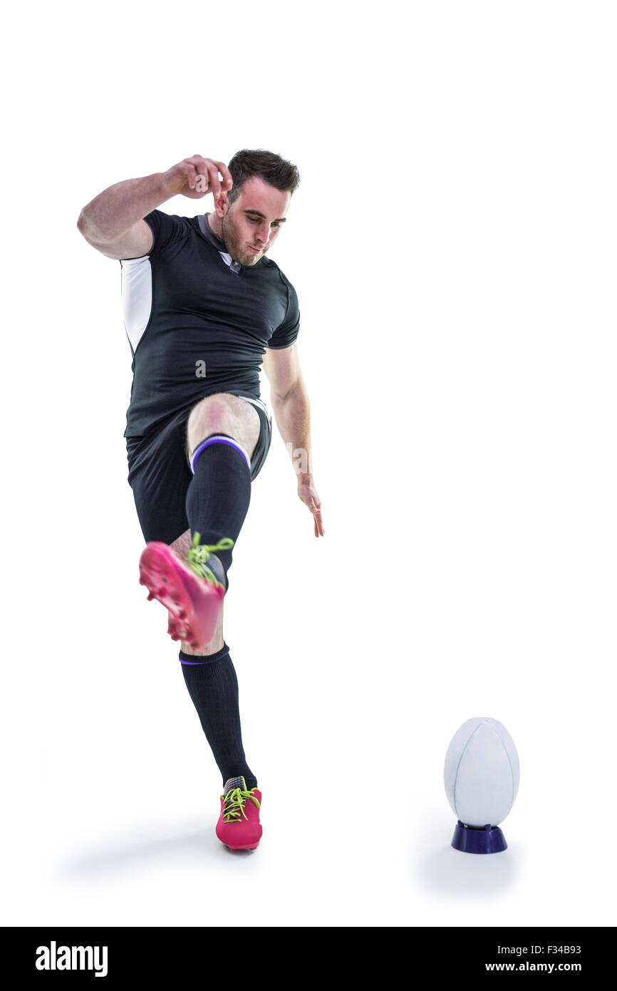 Rugby player kicking the ball Stock Photo - Alamy