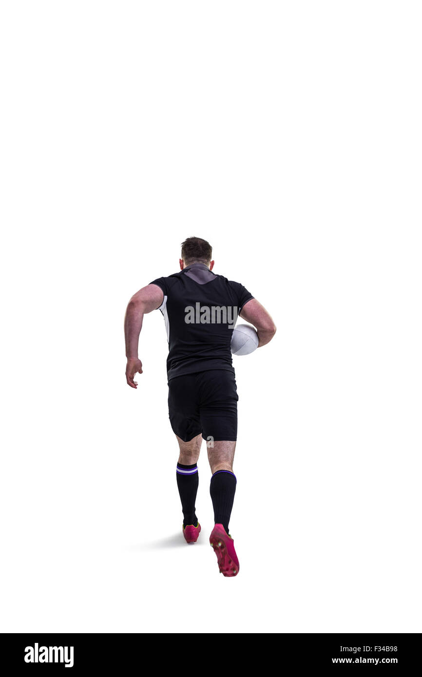 Rugby player running with the ball Stock Photo - Alamy