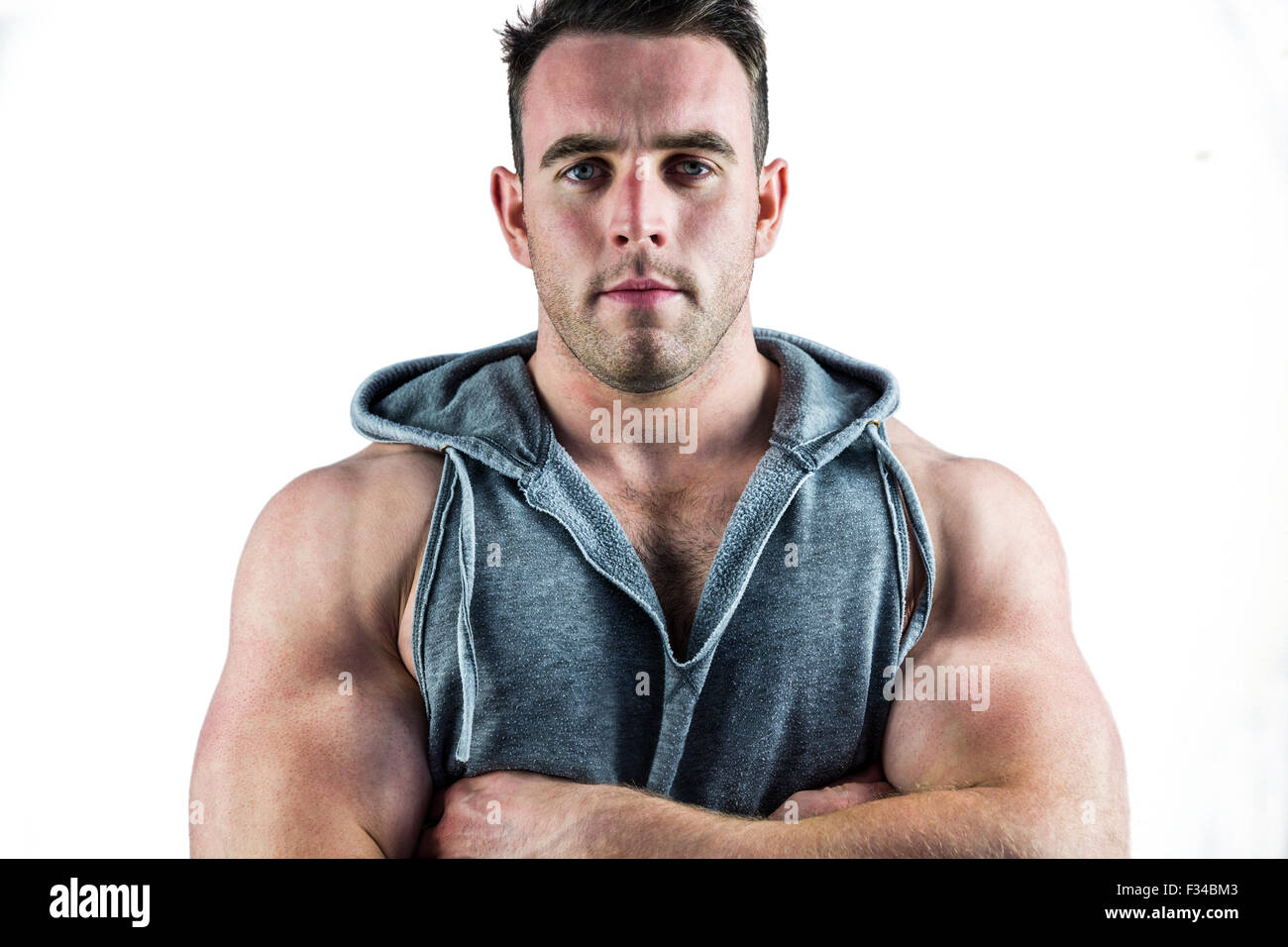 Handsome bodybuilder with arms crossed Stock Photo - Alamy
