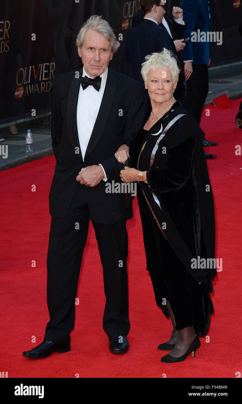 London UK. David Mills and Dame Judi Dench at Laurence Olivier Awards ...