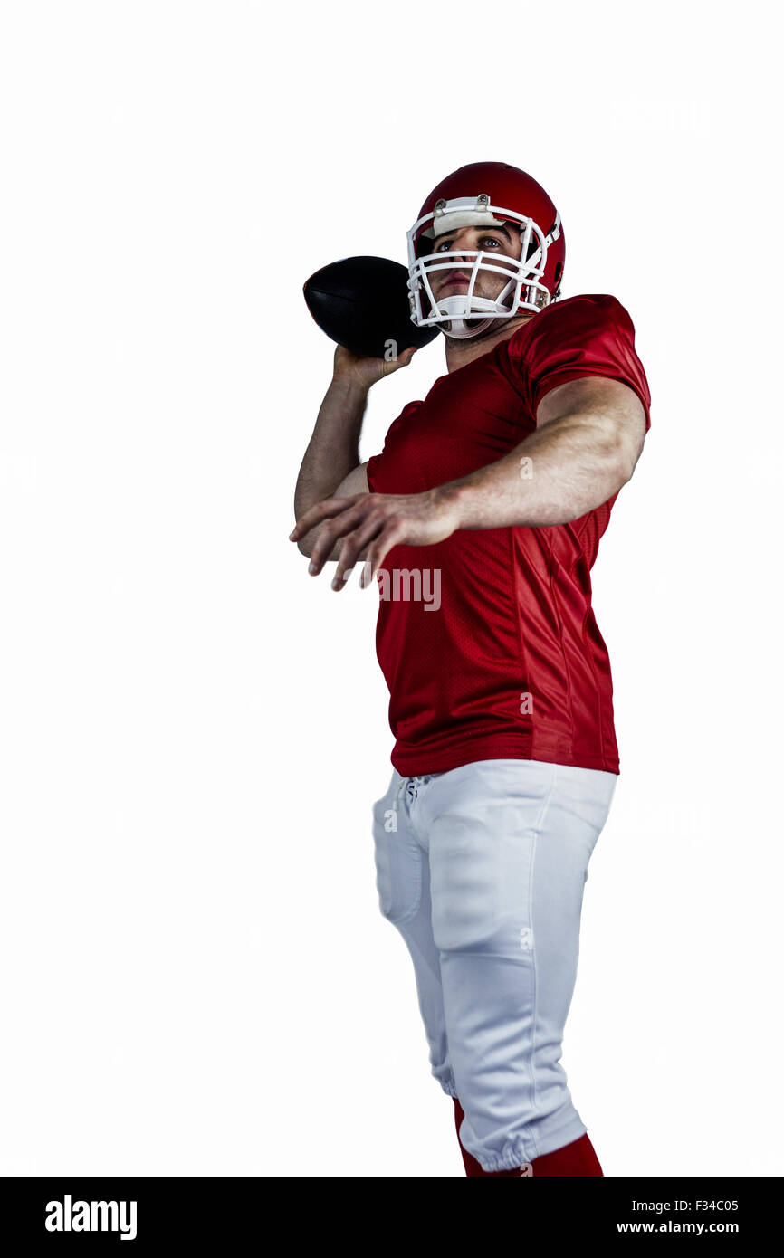 American football player throwing ball Stock Photo - Alamy